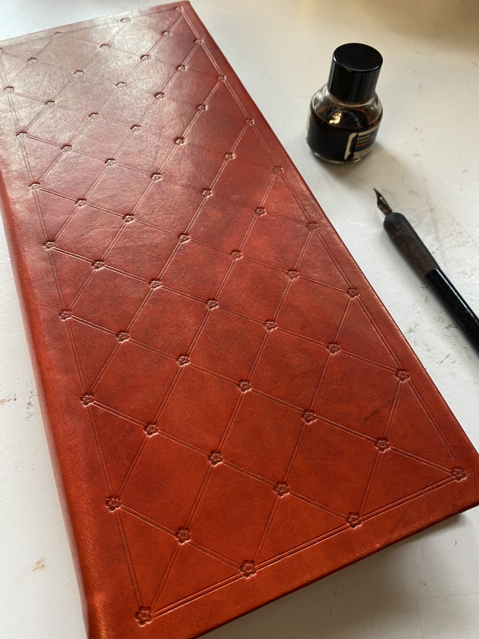 Large, Chunky plain paged book bound in terracotta and pale blue ...